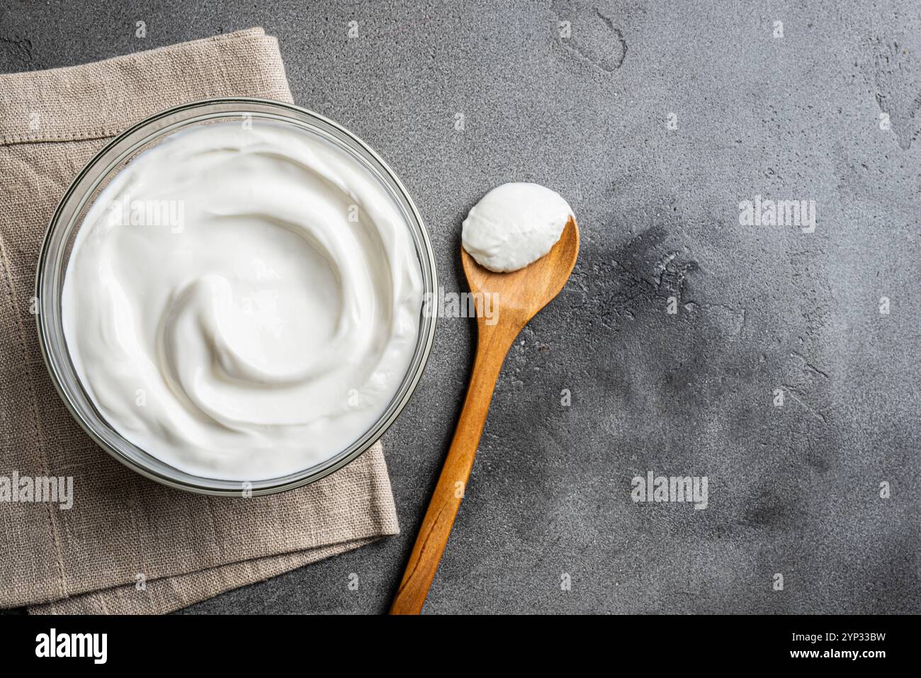 Homemade Greek Yogurt or Labne in bowl on dark stone background, top ...