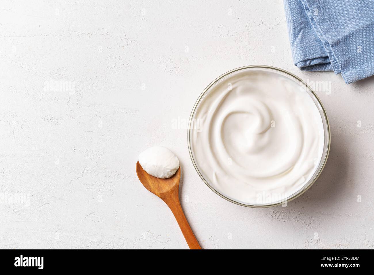 Homemade Greek Yogurt or Labne in blue bowl on white background, top ...