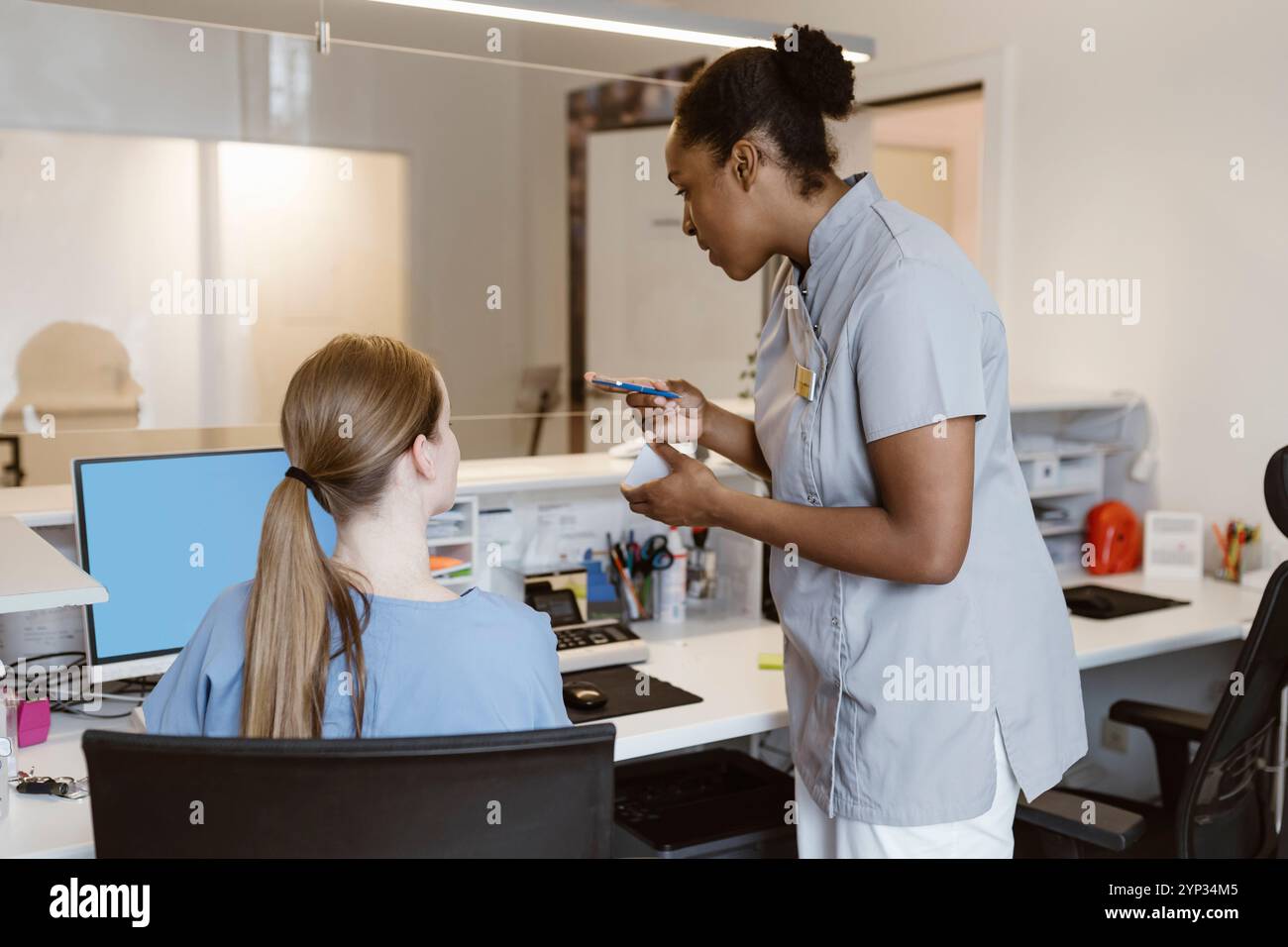 Female doctors receptionist hi-res stock photography and images - Alamy