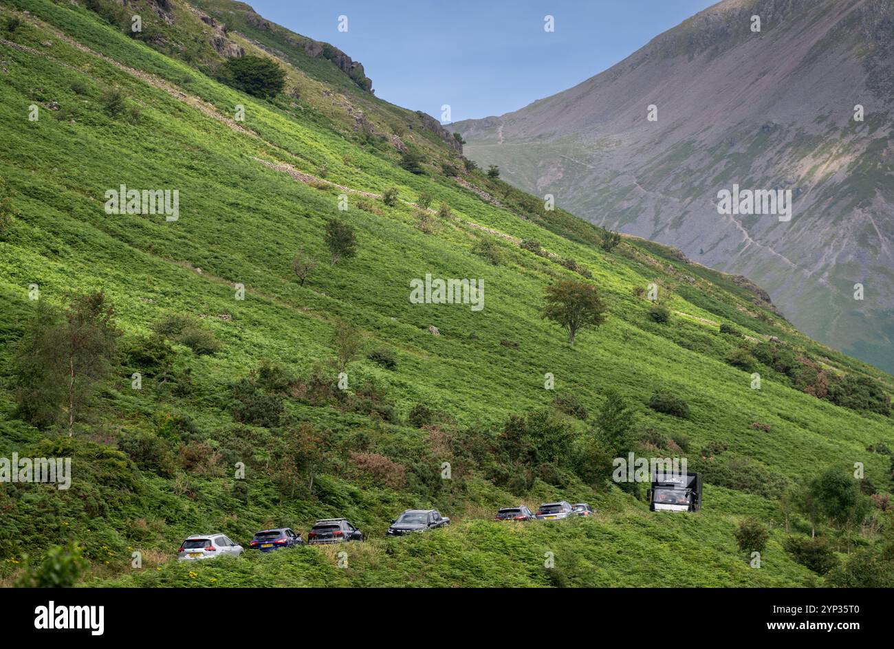 Traffic backed up on a narrow country lane in the Lake District ...