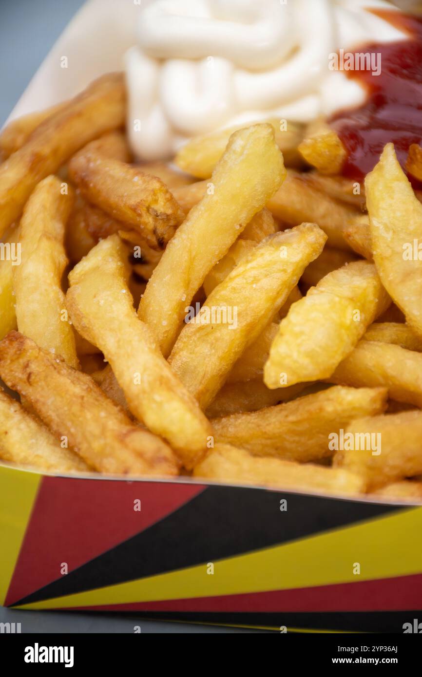 Belgian street and fast food, paper box in colors of Belgian flag with ...