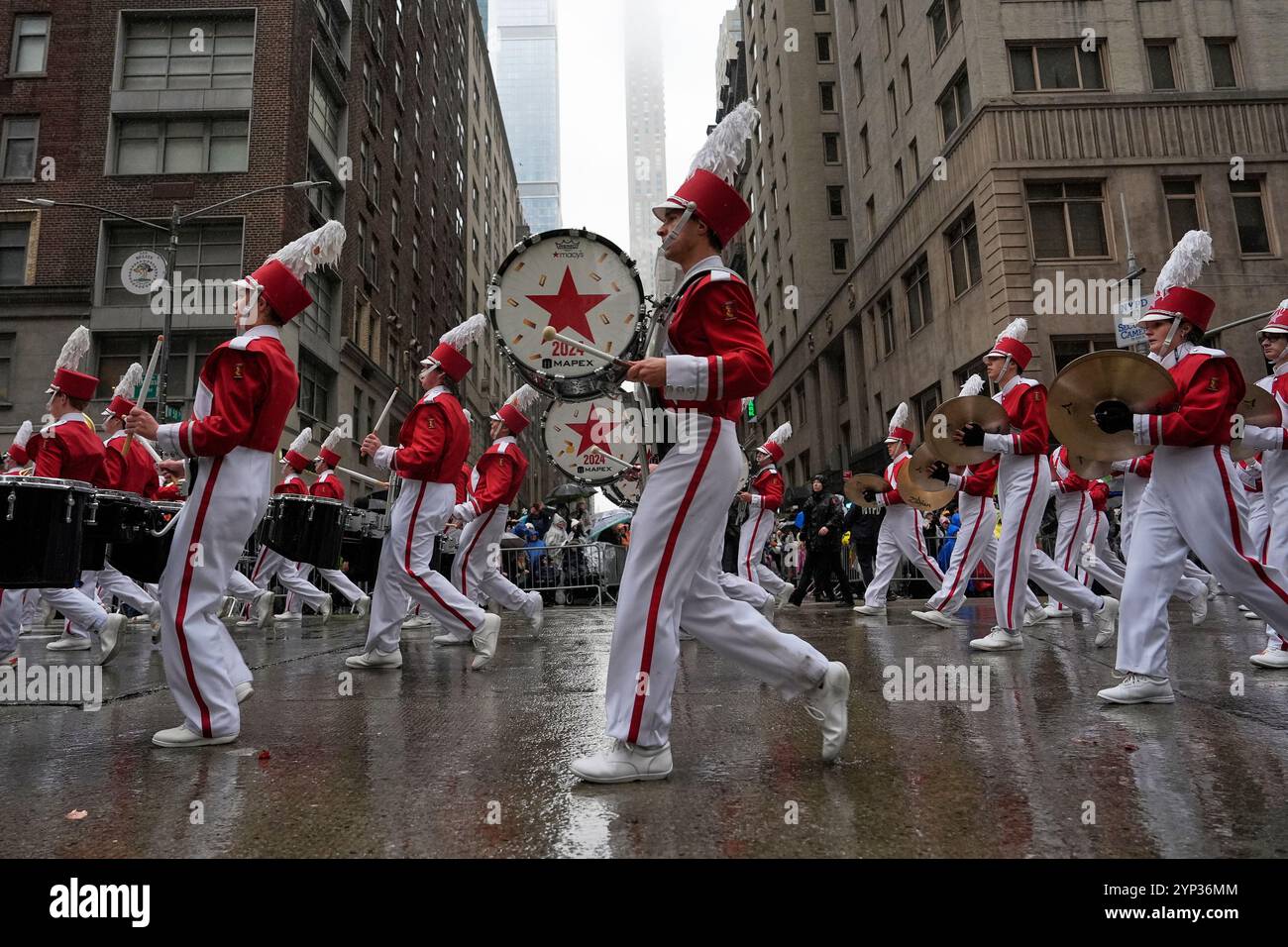 The Macy's Great American Marching Band plays as it heads down Sixth ...