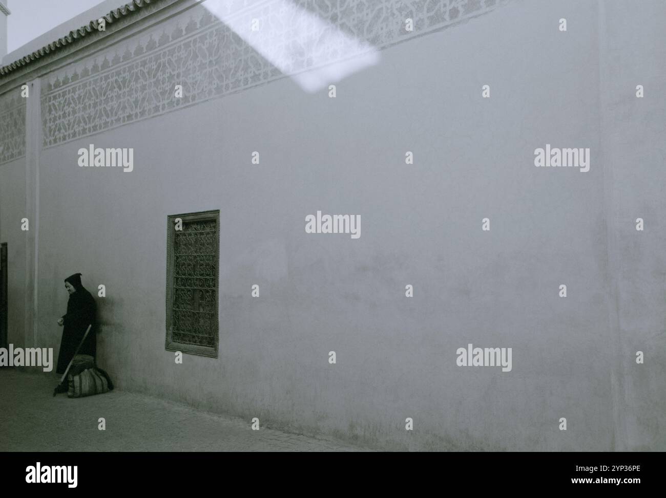 A solitary blind figure asking for alms in the souk casbah in the old ...