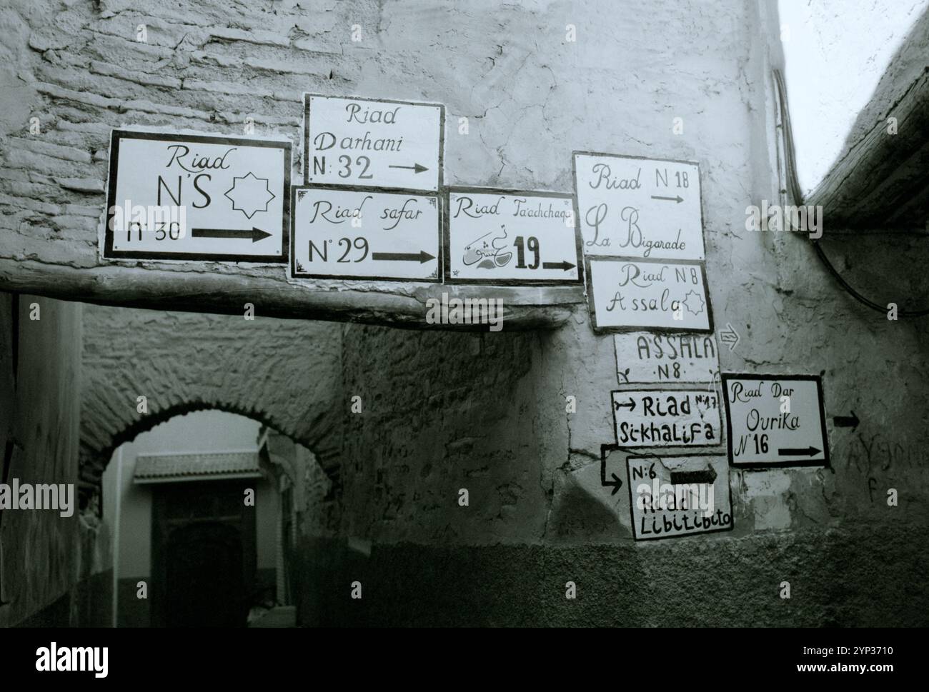 Riad signs in the alleyway of the casbah souk in the old city of ...