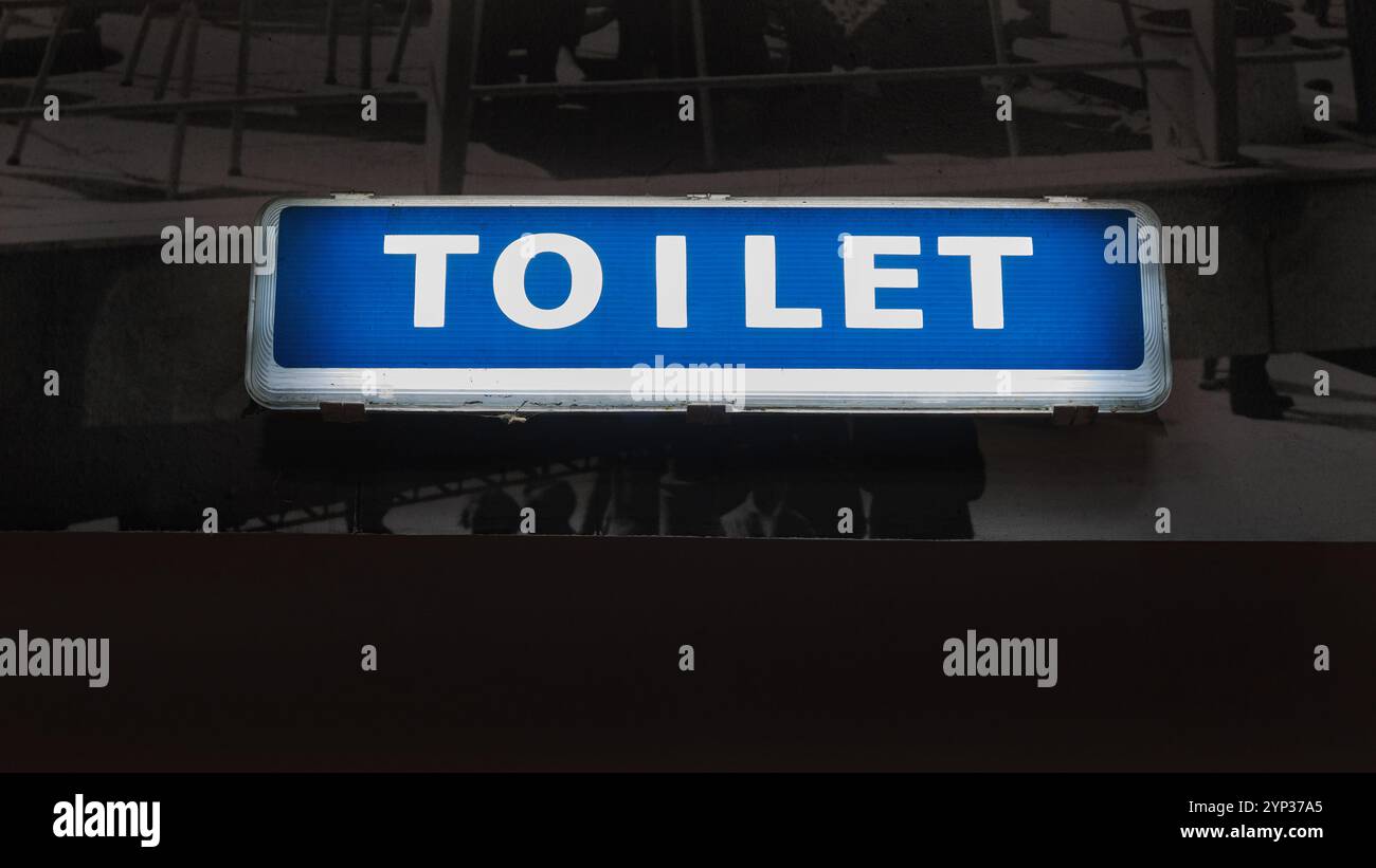 Illuminated Neon Sign at Old Public Toilet Facility Stock Photo - Alamy