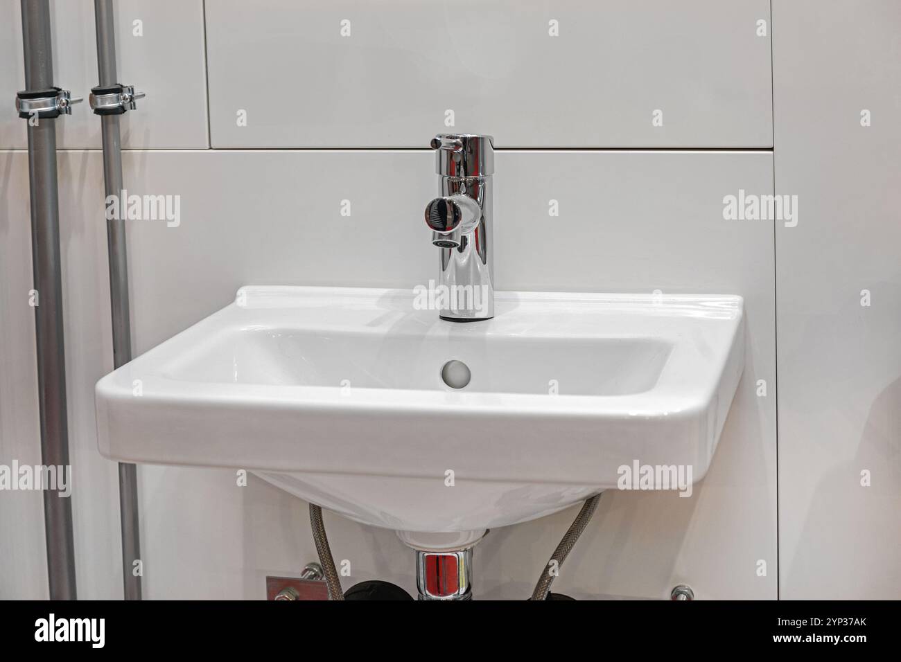 White Ceramic Rectangular Wash Basin With Silver Faucet in Small ...