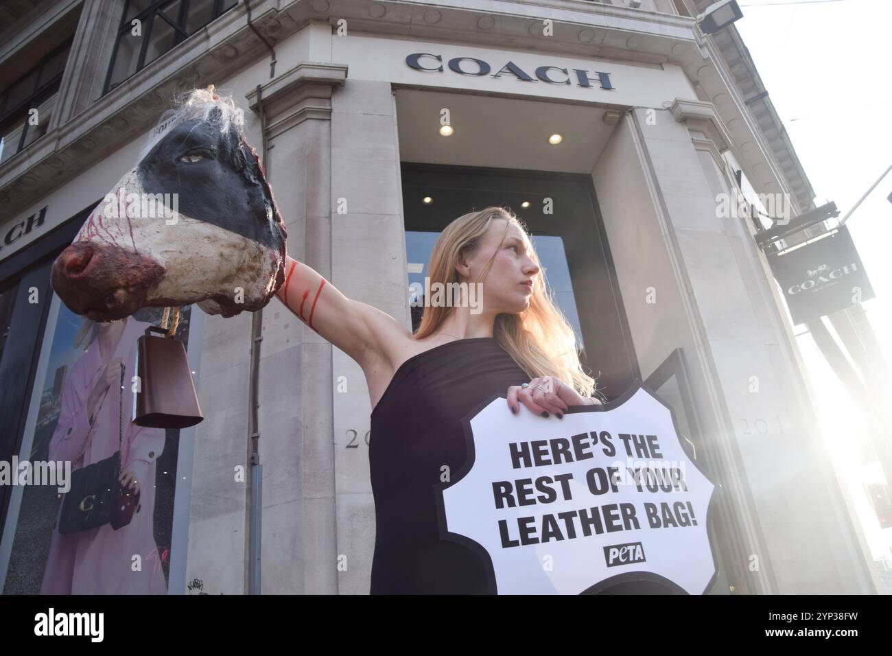 London, UK. 28th November 2024. A PETA activist stands outside the ...