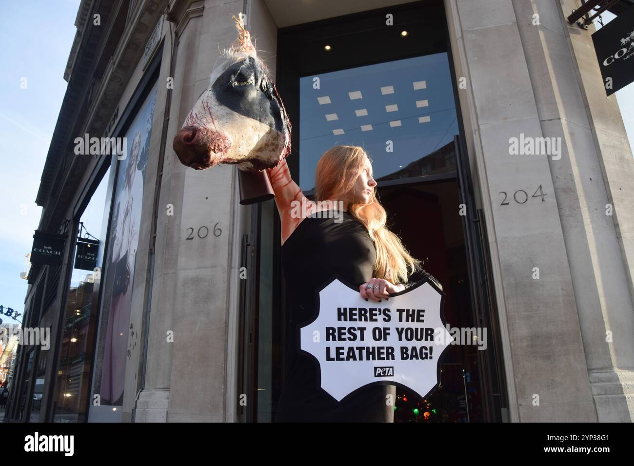 London, UK. 28th November 2024. A PETA activist stands outside the ...