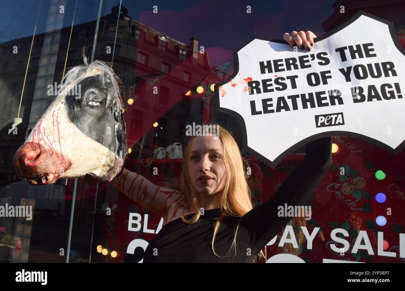 London, UK. 28th November 2024. A PETA activist stands outside the ...