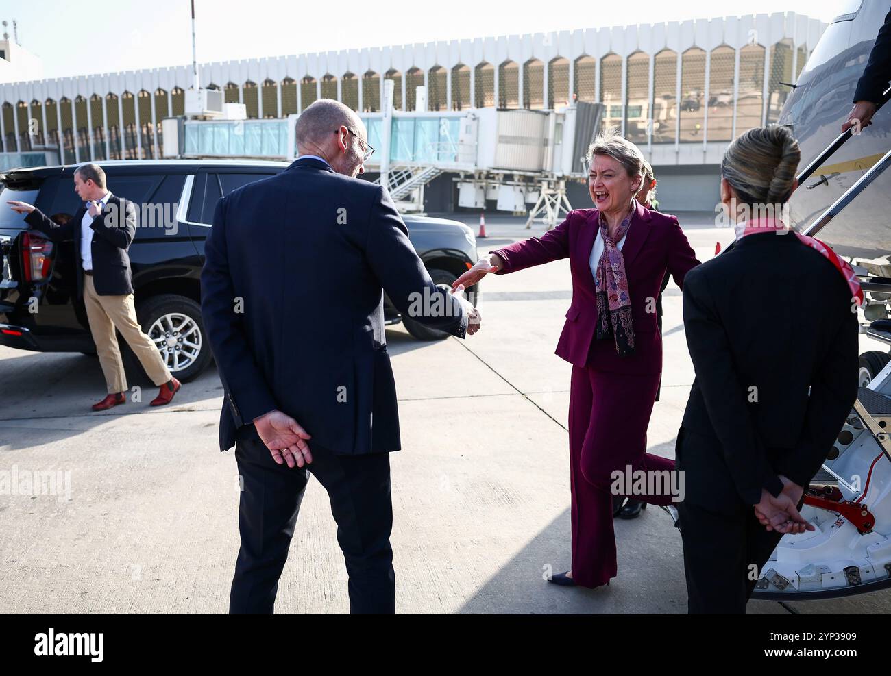Home Secretary Yvette Cooper is greeted by the UK Ambassador to Iraq ...