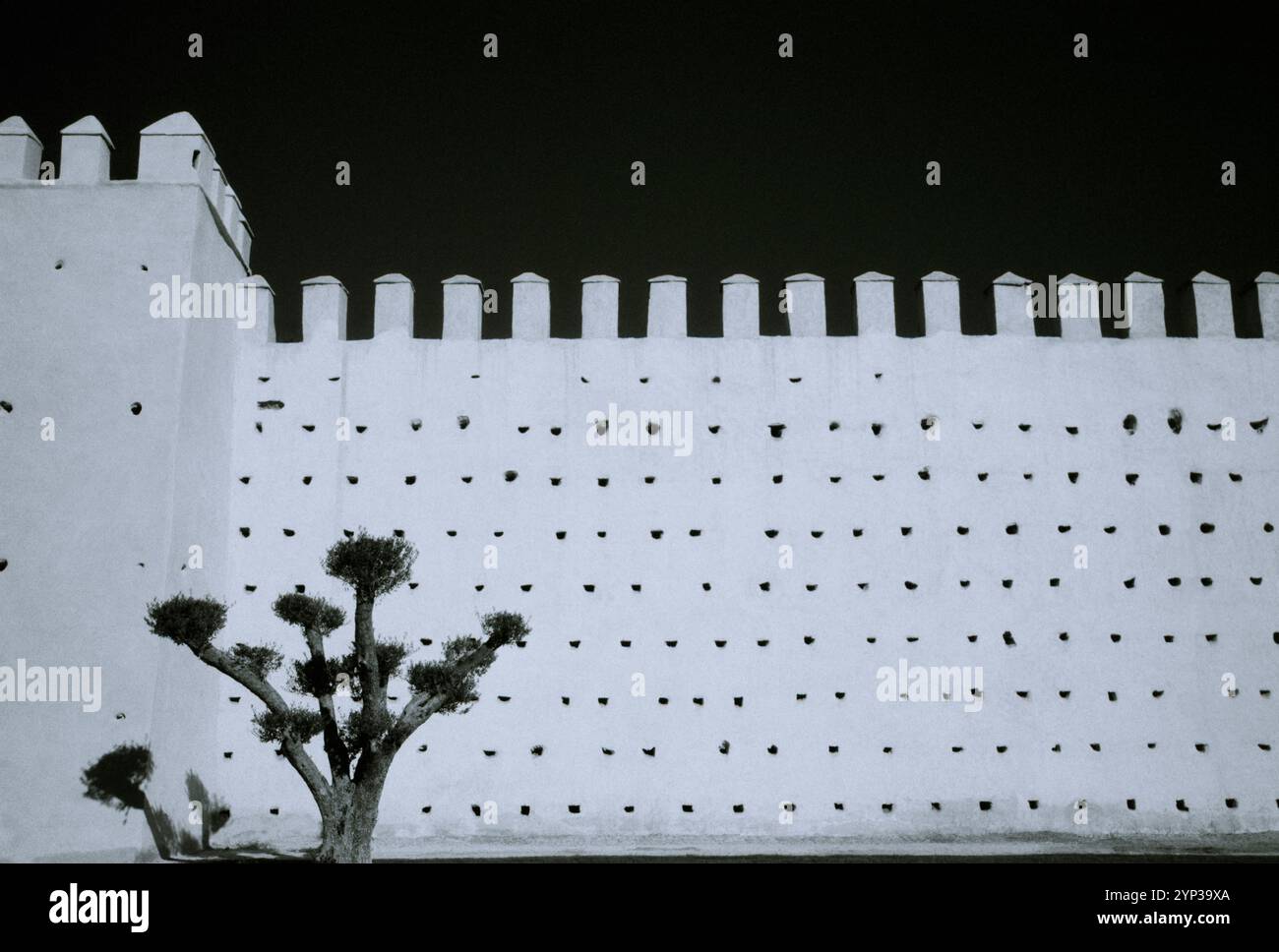Ancient city walls of the medina of the old city of Marrakesh in ...