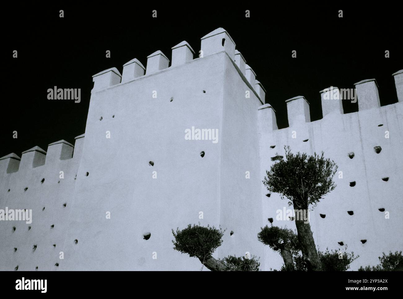 Ancient city walls of the medina of the old city of Marrakesh in ...