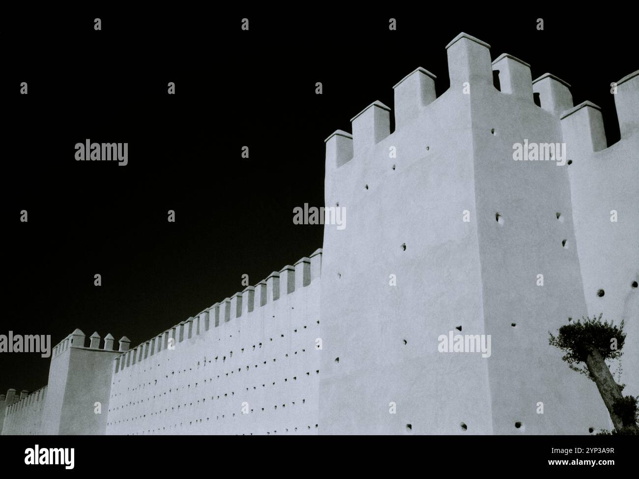 Ancient city walls of the medina of the old city of Marrakesh in ...