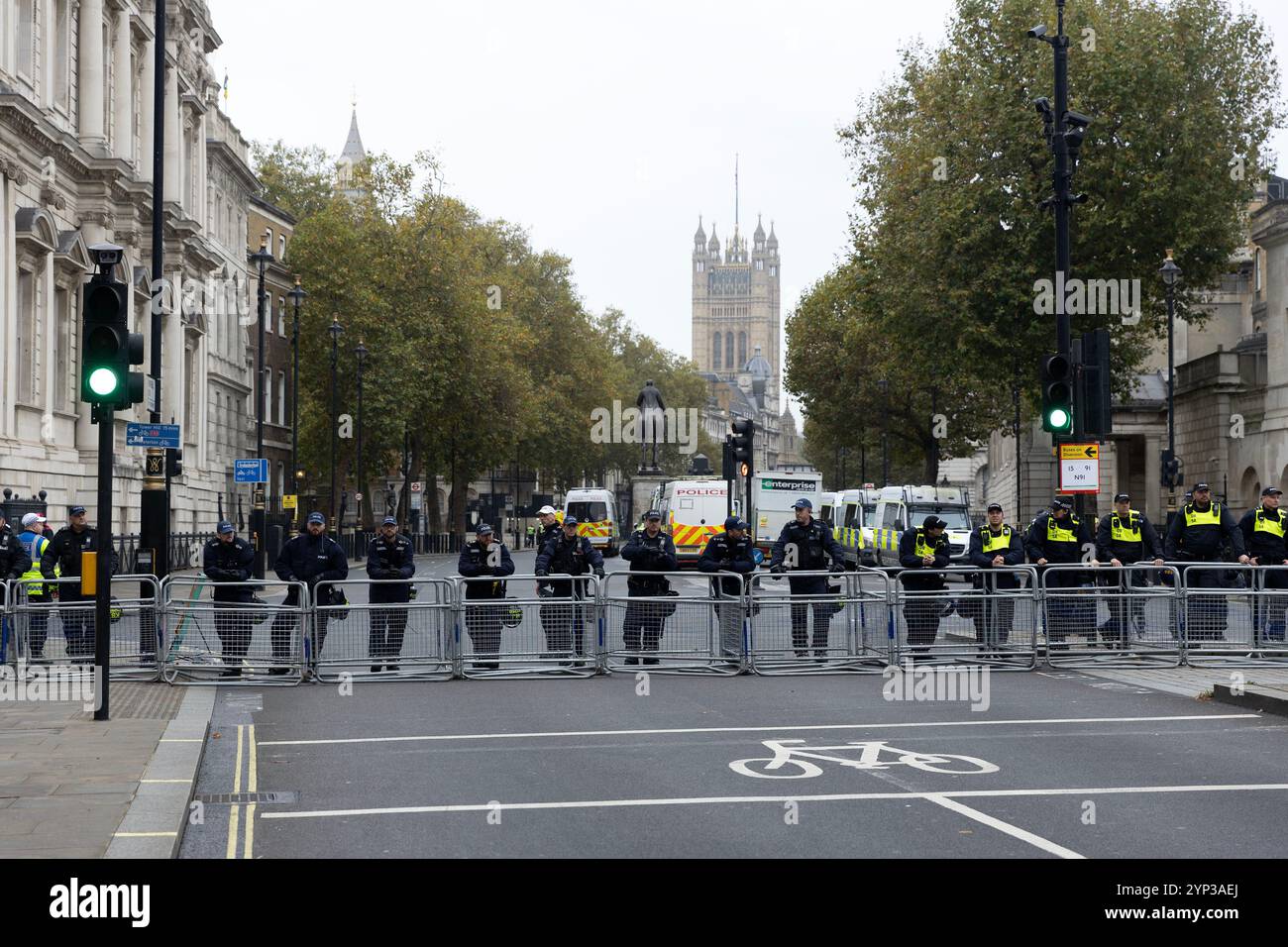 Police officers close the road as anti-racism counter-protesters rally ...