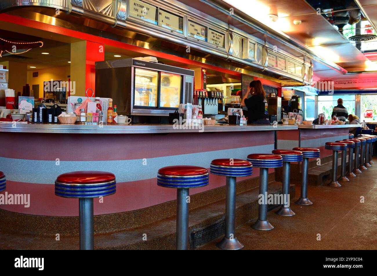 Round stool line the curved counter inside a classic vintage Stock ...