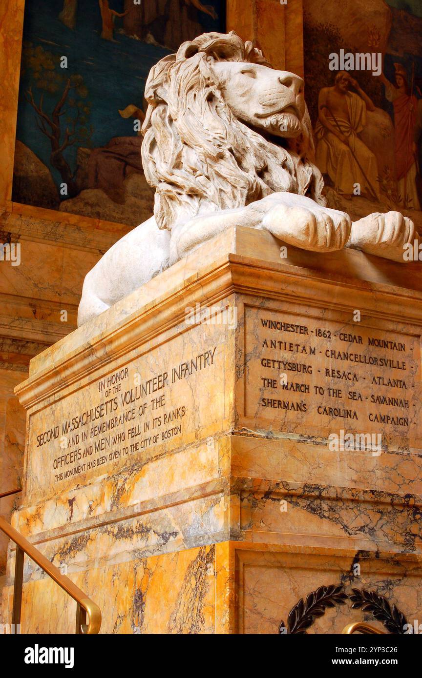 A stately lion sits regally at the main staircase in the Boston Public ...