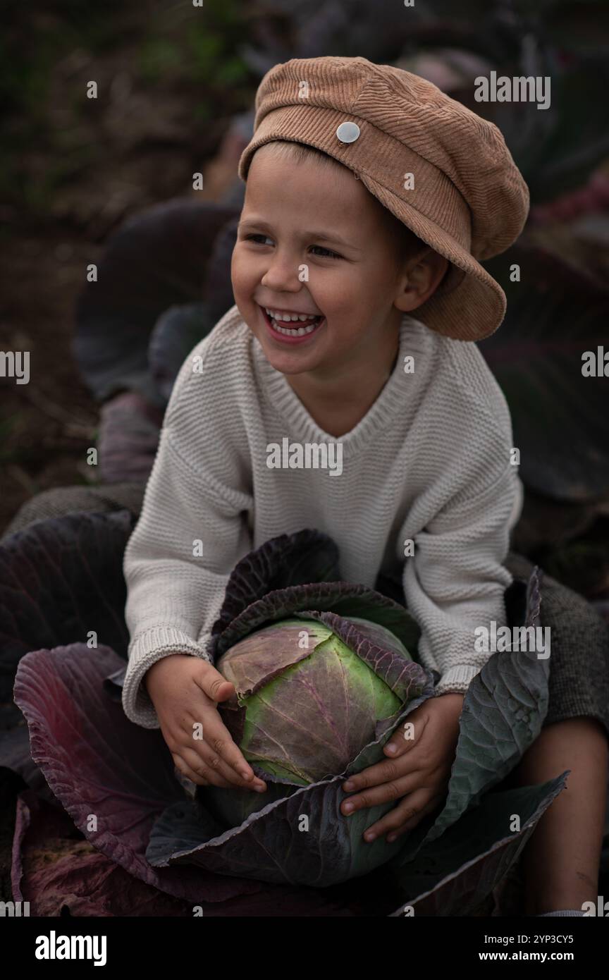 Small girl sitting on stone hi-res stock photography and images - Alamy