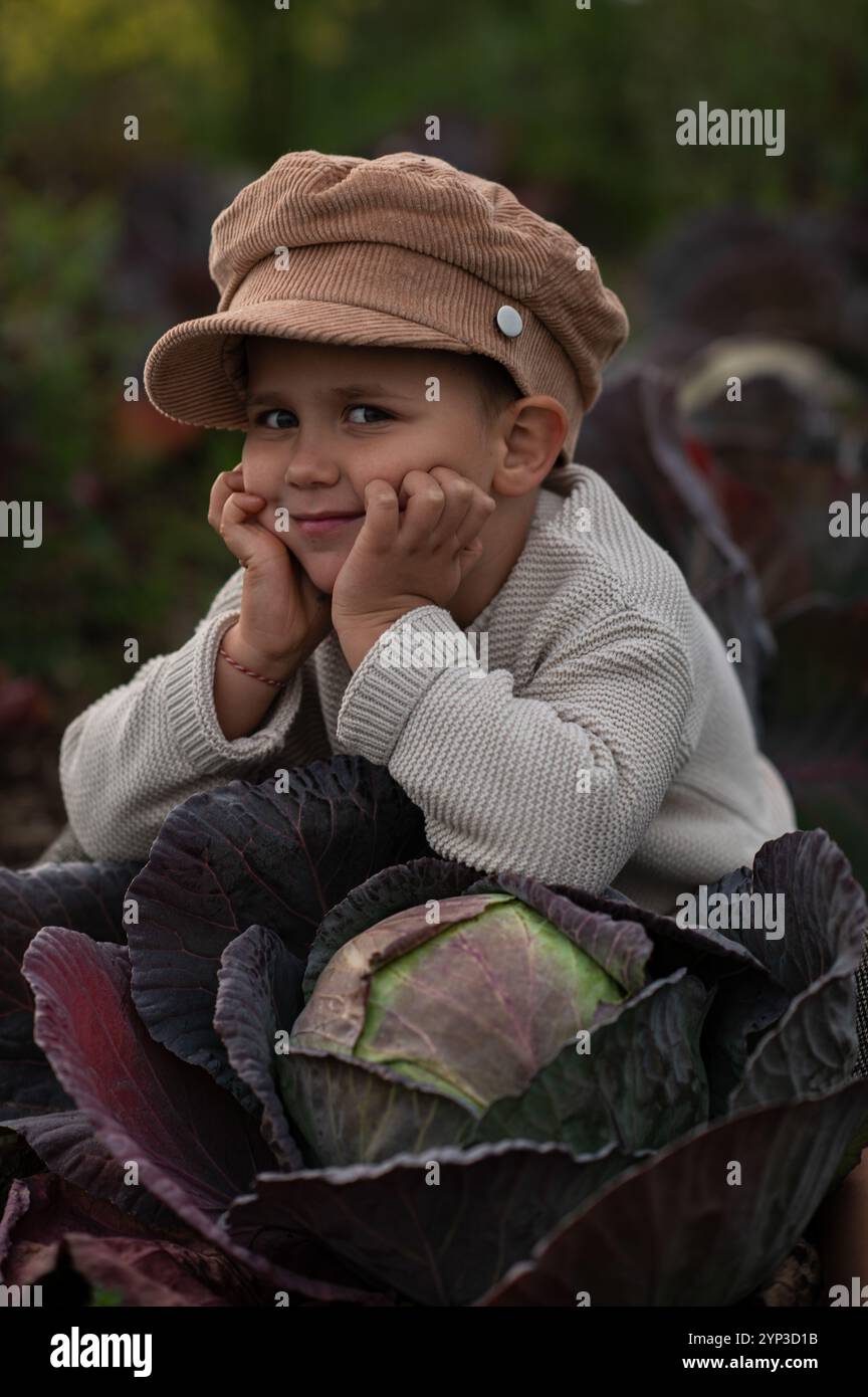 Small girl sitting on stone hi-res stock photography and images - Alamy
