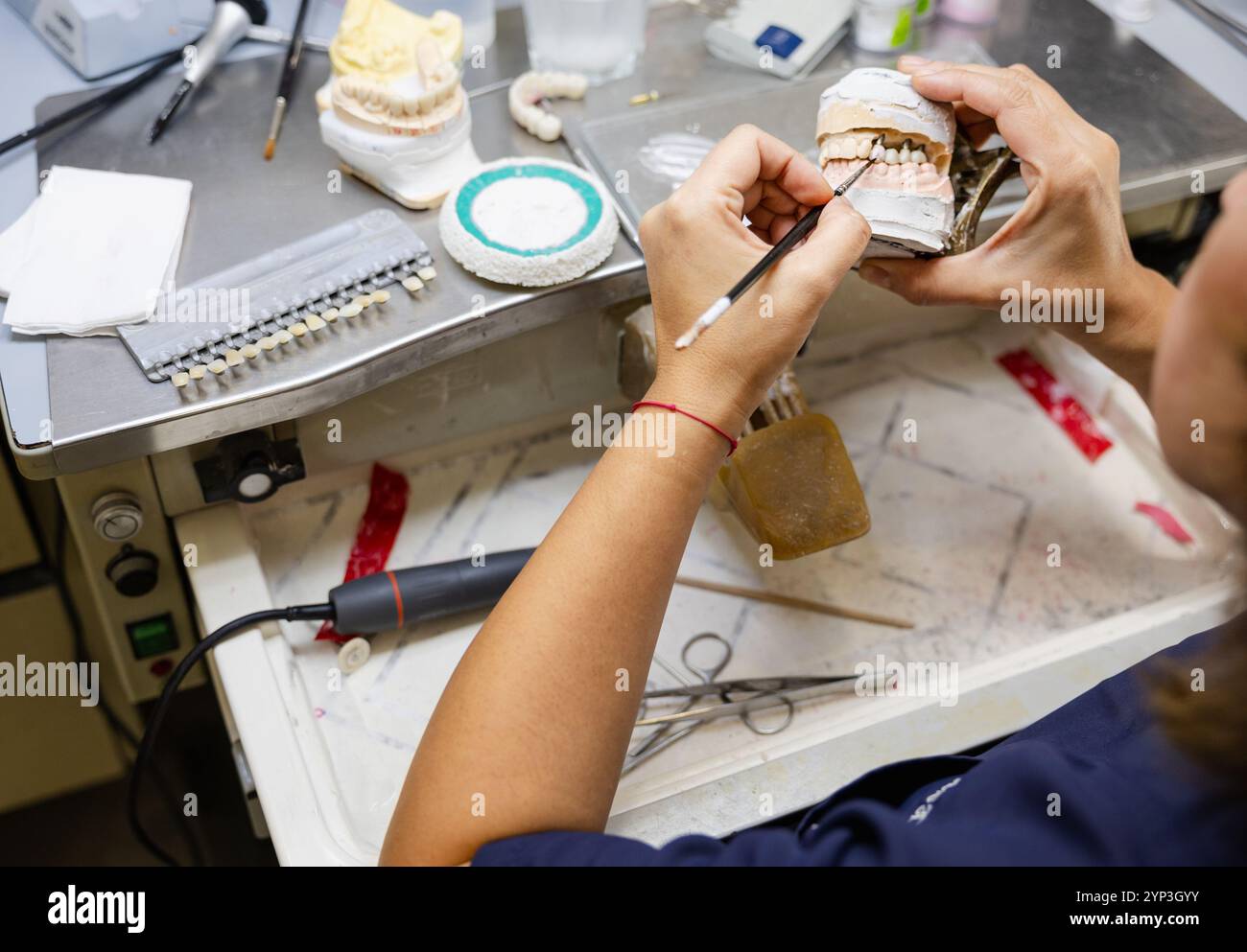 Dental technician making dentures hi-res stock photography and images ...