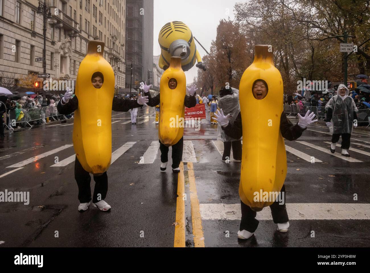 Parade performers lead the Stuart the Minion float down Central Park ...