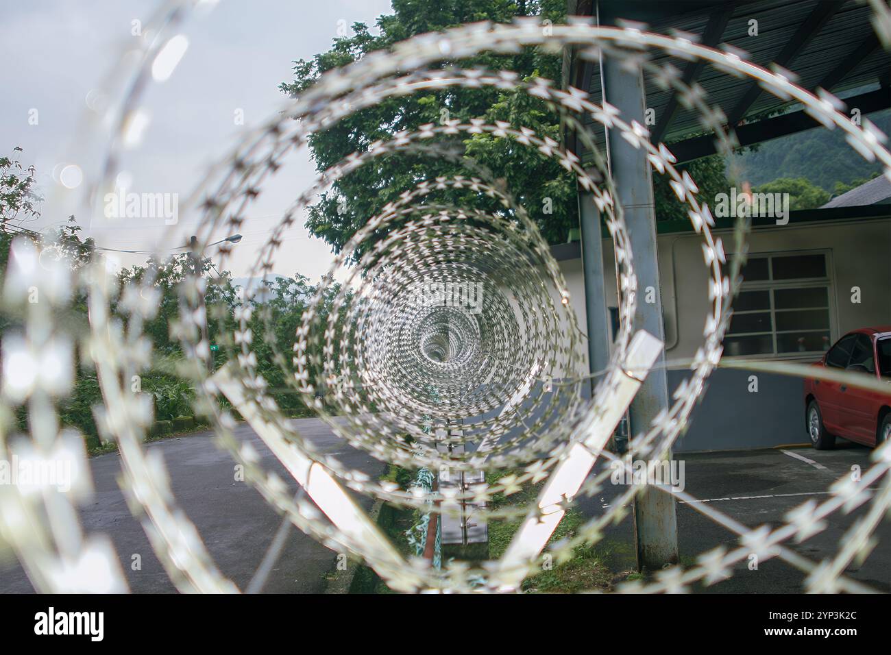 A close-up of a razor wire coil barrier in New Taipei City, Taiwan. The ...