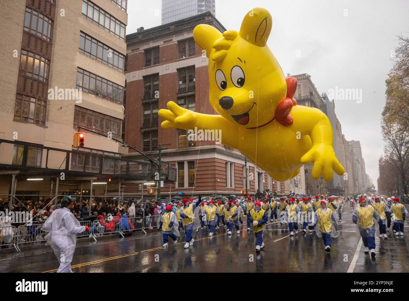 A balloon floats by along Central Park West during the Macy's ...