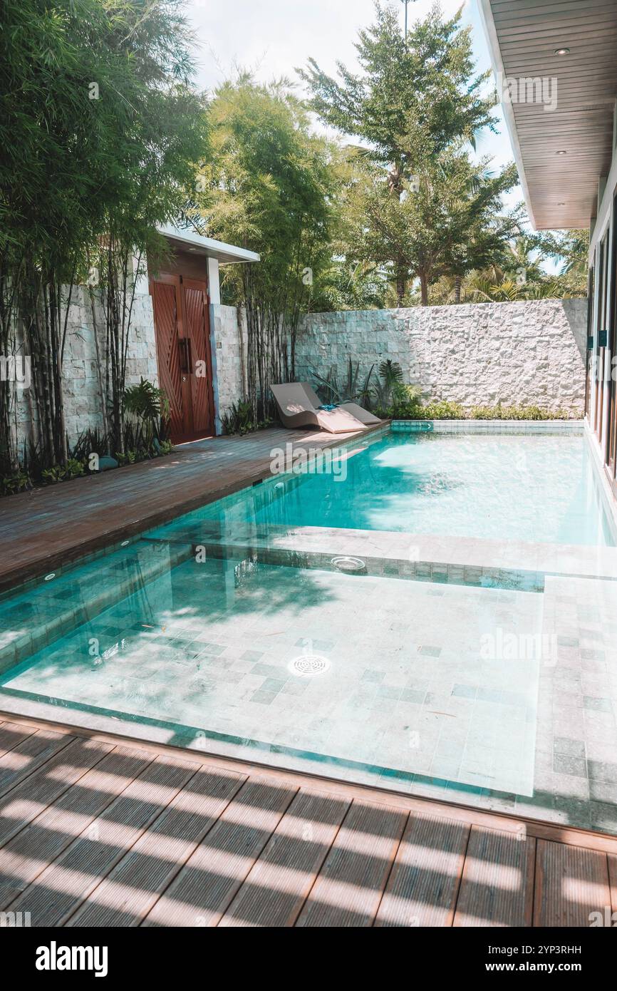 Beautiful swimming pool inside a tropical beach resort in the ...