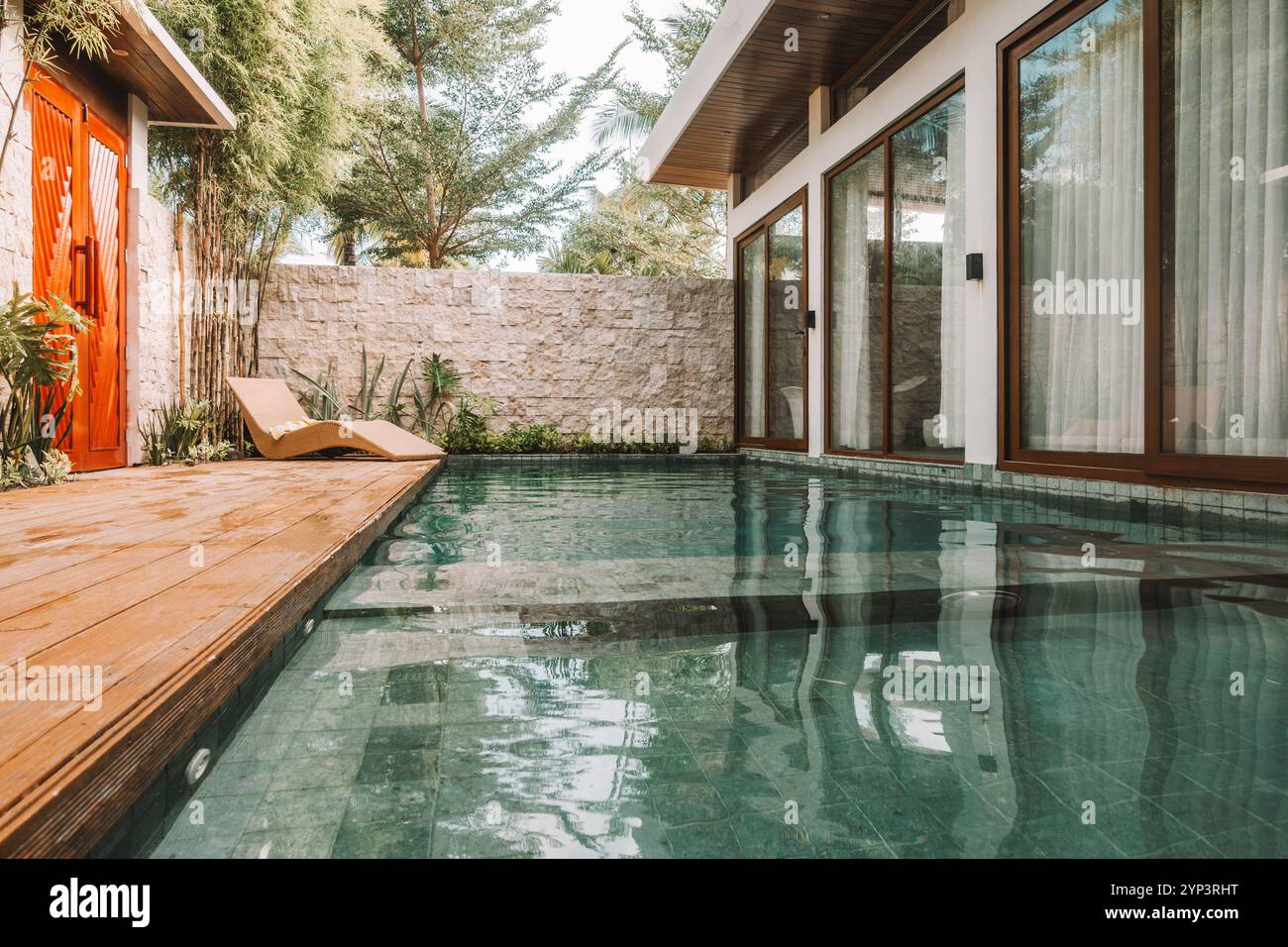 Beautiful swimming pool inside a tropical beach resort in the ...