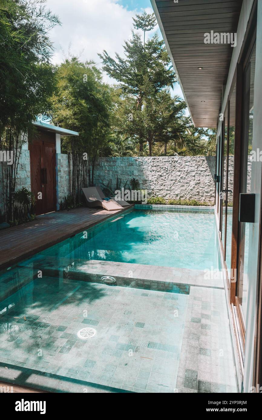 Beautiful swimming pool inside a tropical beach resort in the ...