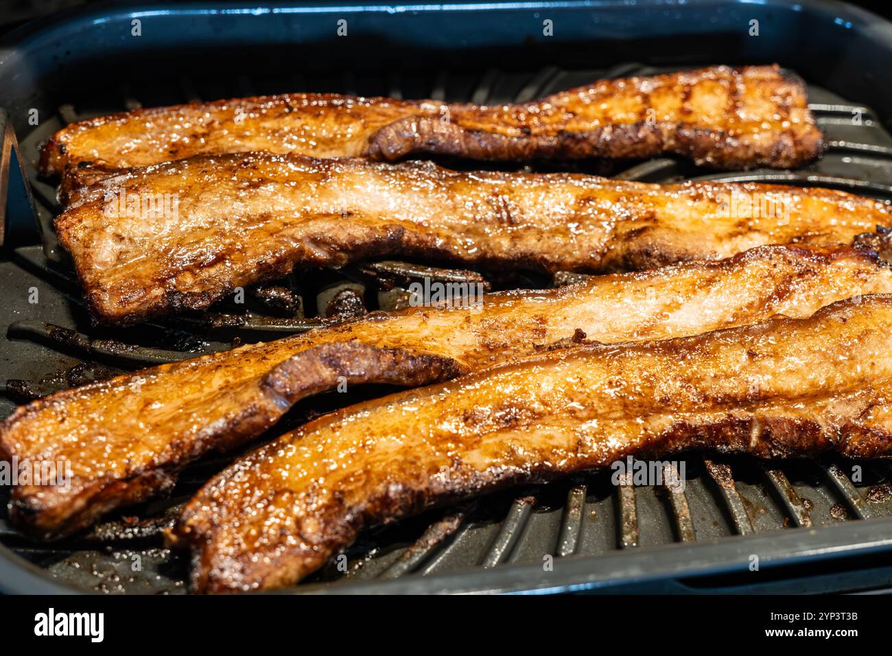 Grilling a pork belly liempo in a Ninja Foodie indoor grill. This is a ...