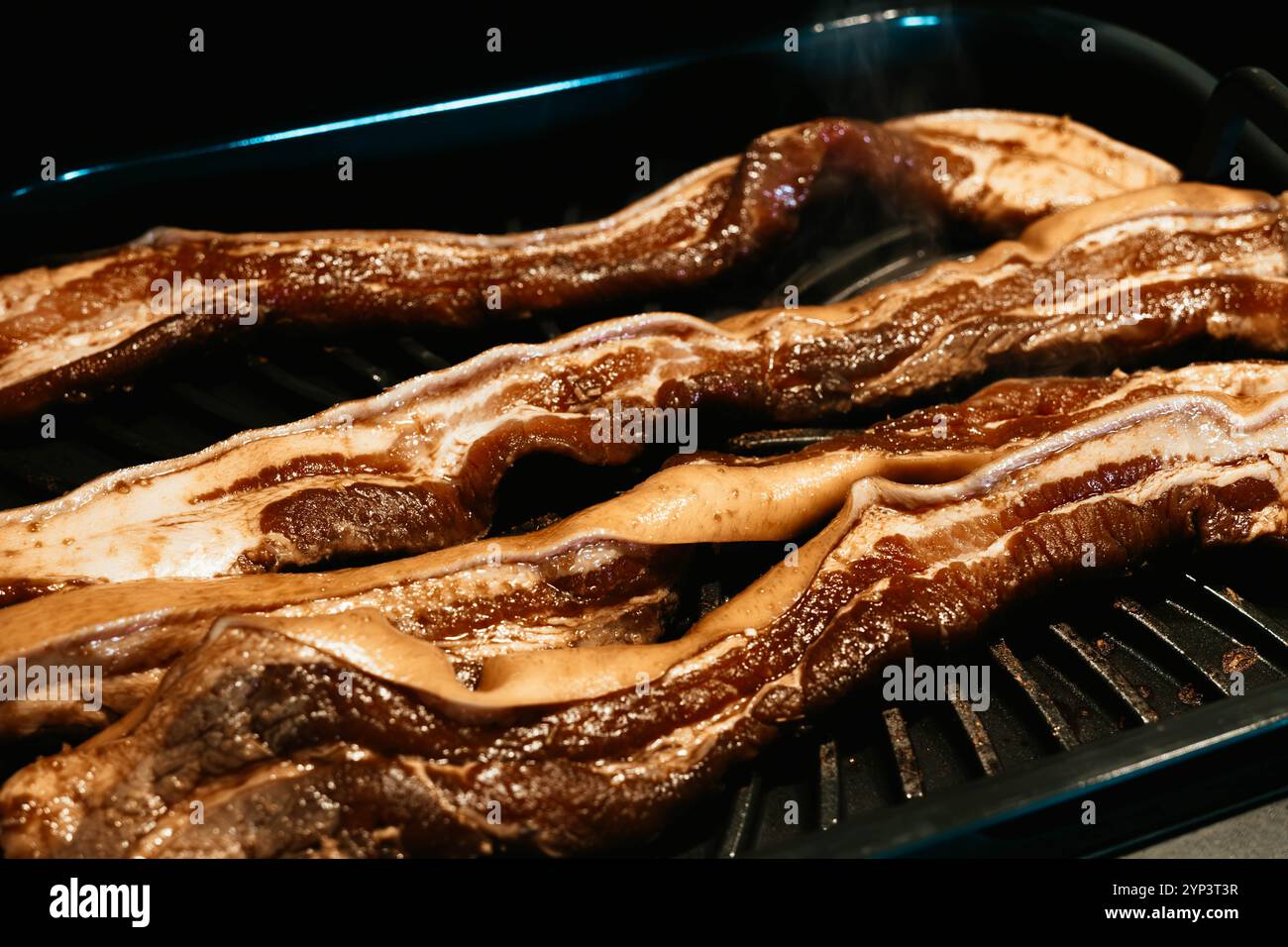 Grilling a pork belly liempo in a Ninja Foodie indoor grill. This is a ...