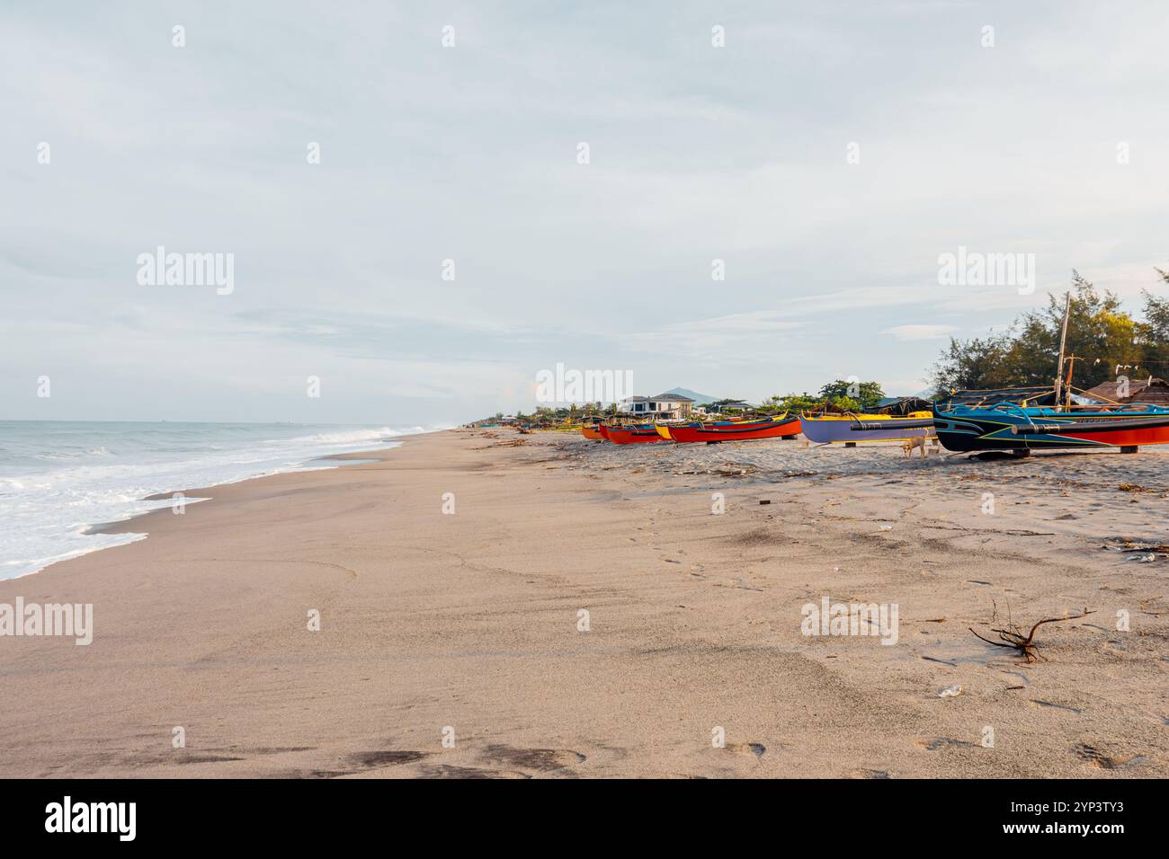 Beautiful fine white sand beach with fishing boats at the shore Stock ...