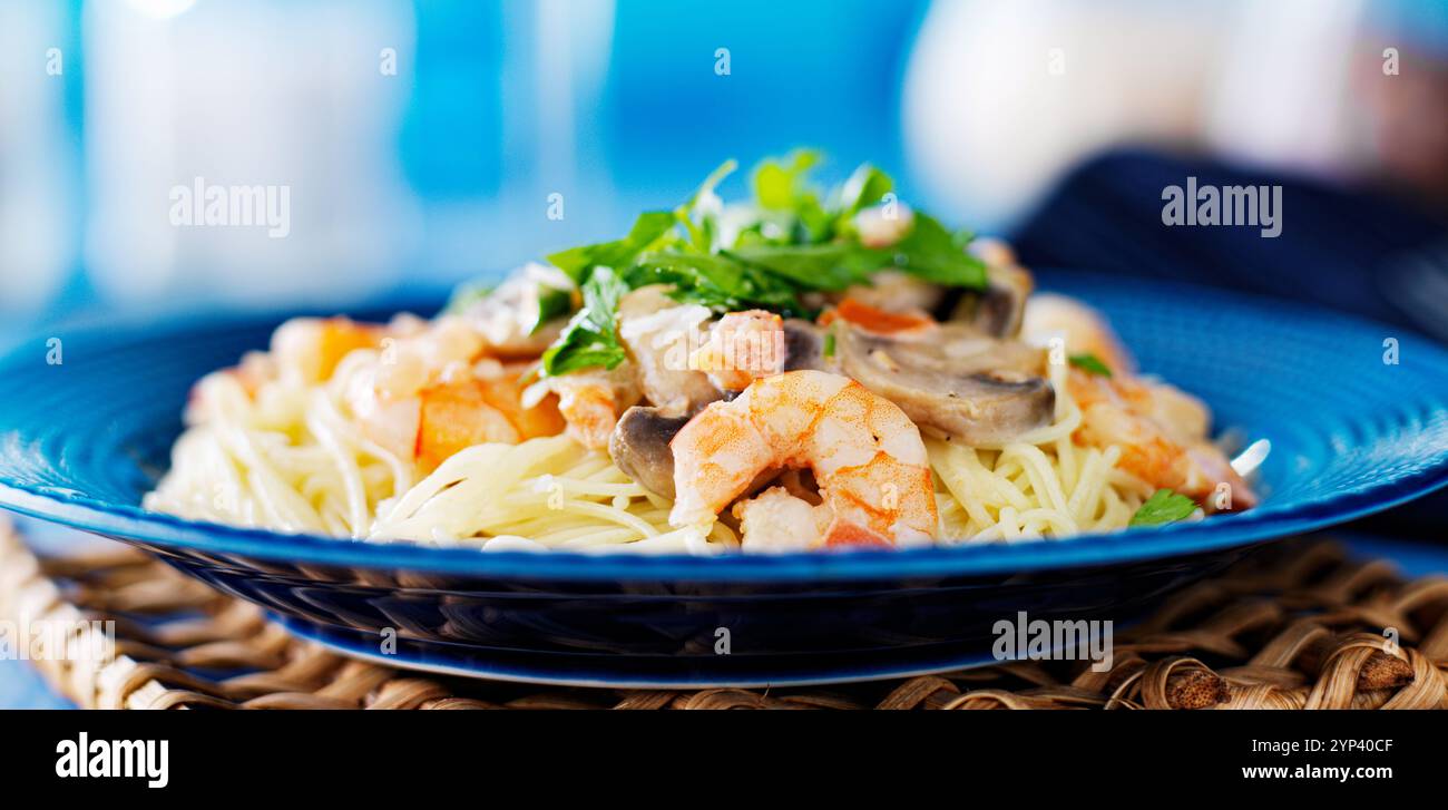 shrimp angel hair pasta with mushrooms and parsley Stock Photo - Alamy