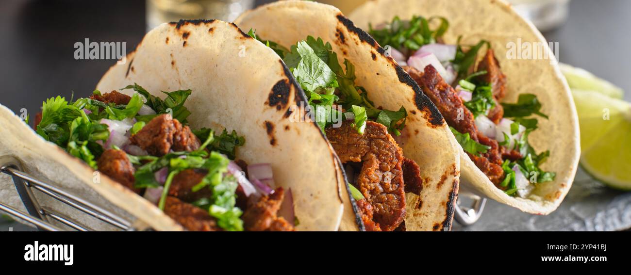 taco holder with three mexican street tacos Stock Photo - Alamy