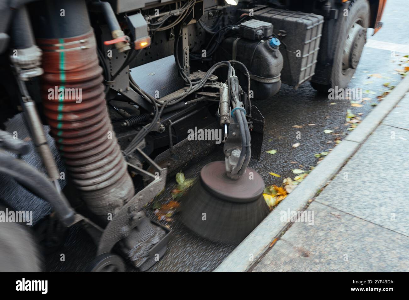 Working rotating brush of city cleaning machine Stock Photo - Alamy