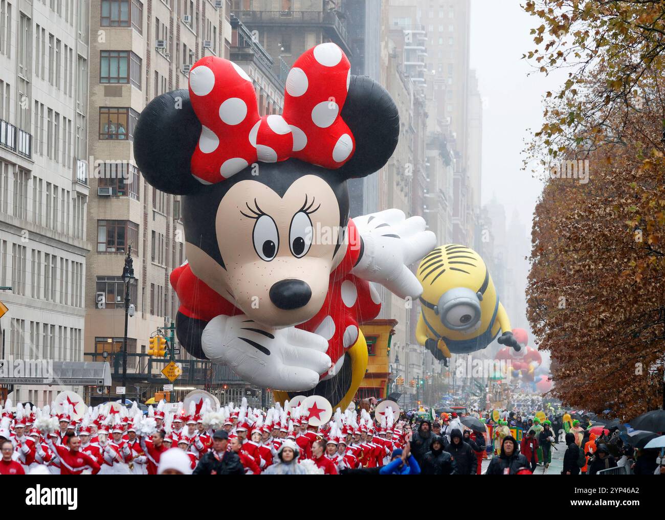 Disney's Minnie Mouse balloon floats past Columbus Circle in the rain ...