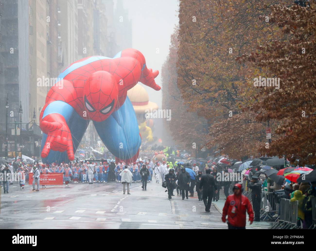 The Spider-Man balloon floats past Columbus Circle in the rain during ...