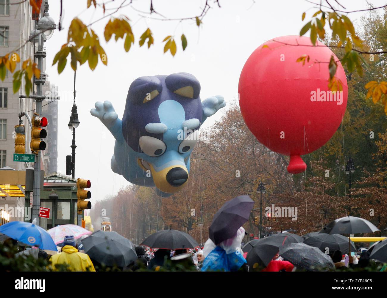 The Bluey balloon floats past Columbus Circle in the rain during the ...