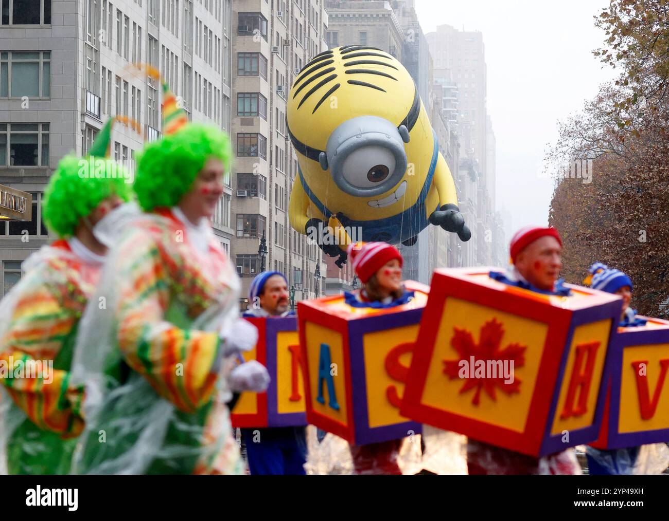 The Stuart the Minion balloon floats past Columbus Circle in the rain ...