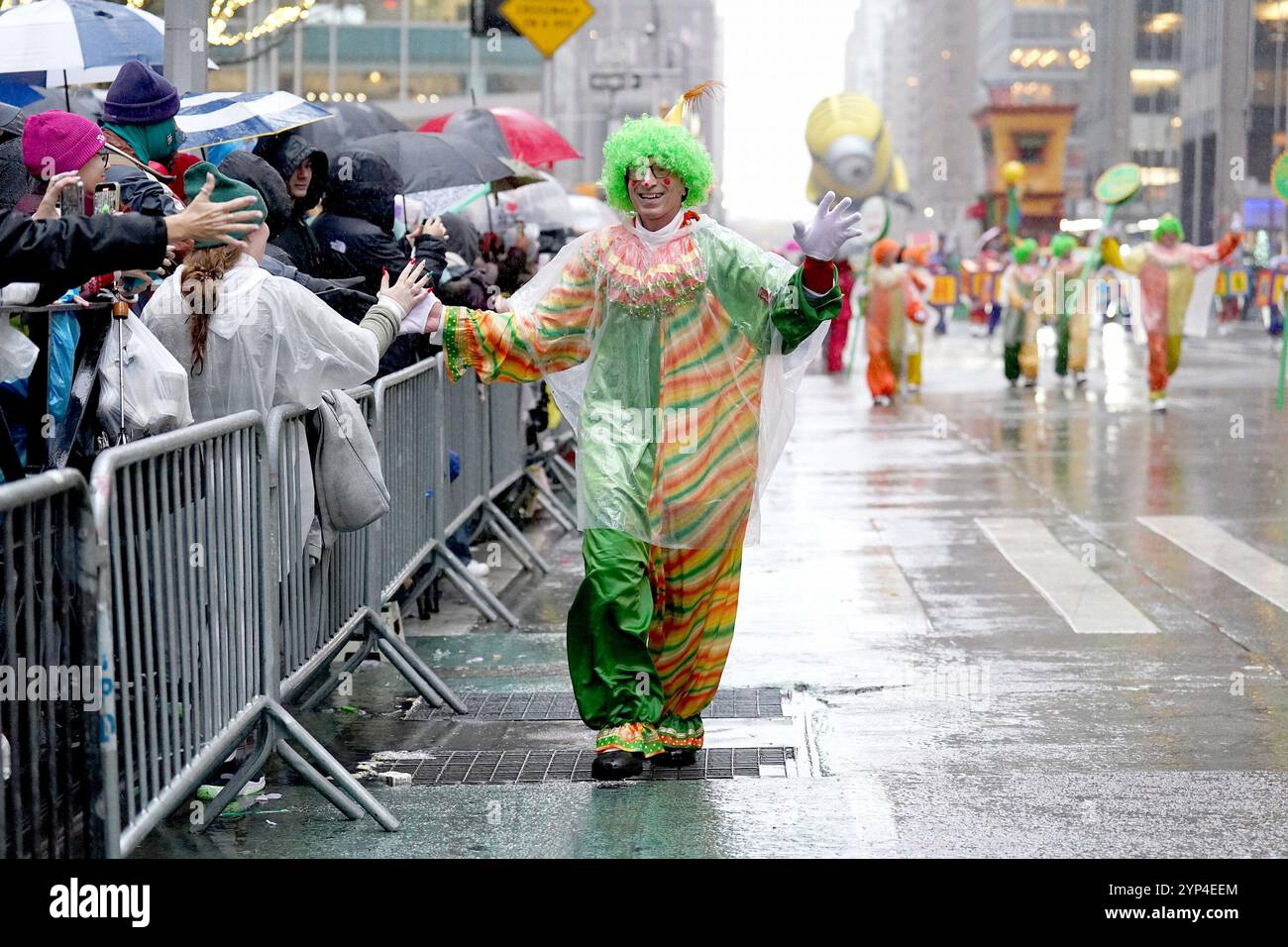 Clown, crowd out and about for Macy's Thanksgiving Day Parade, Midtown ...