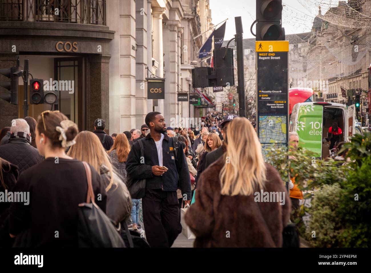 LONDON- NOVEMBER 25, 2024: Regent Street, busy London street scene. Landmark London retail ...