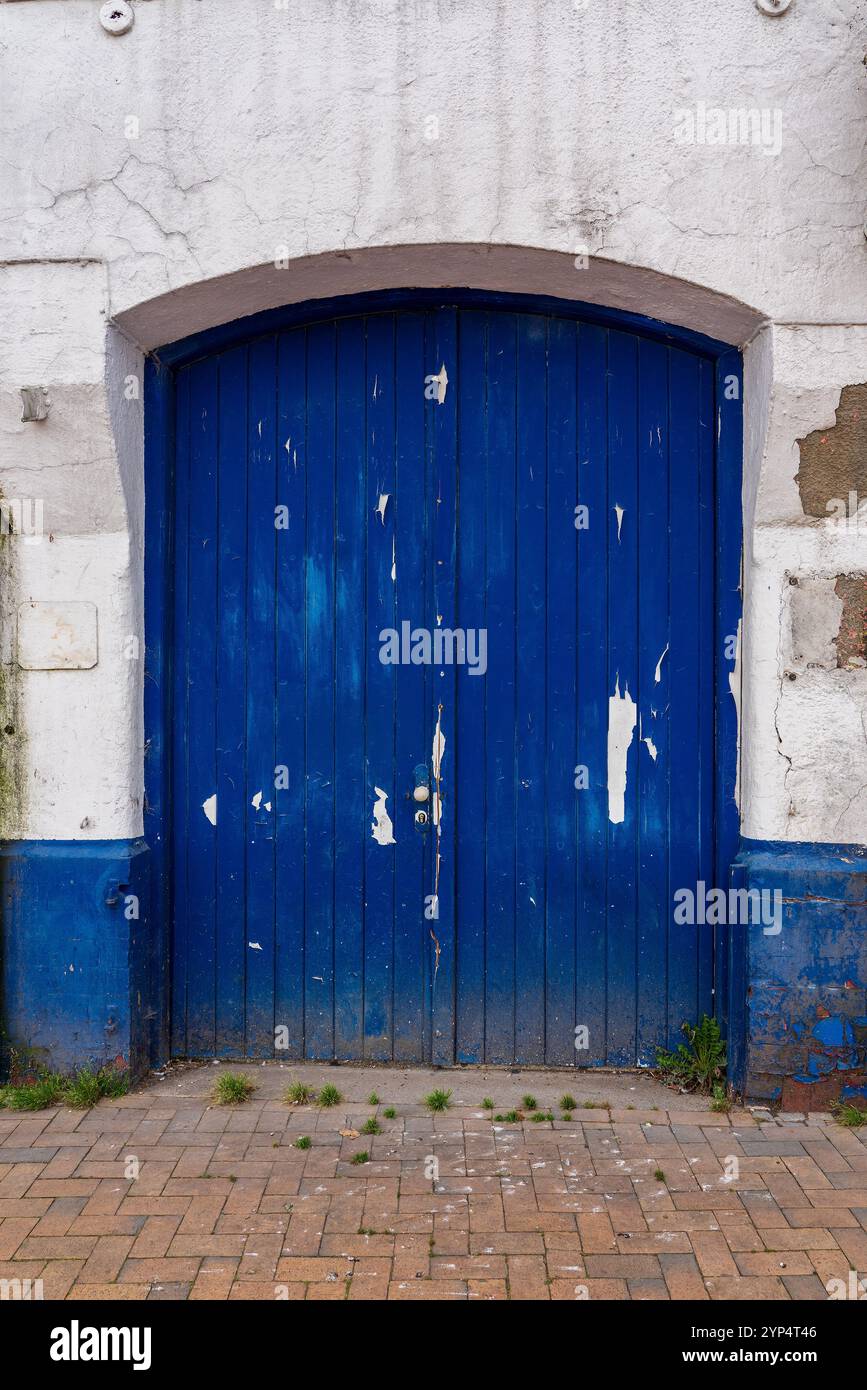 Blue entrance gate on white wall, Germany Stock Photo - Alamy