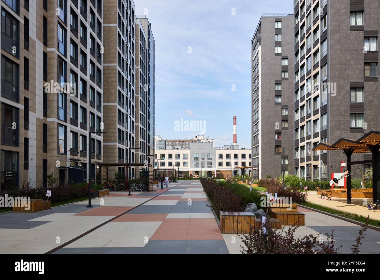 A modern urban residential district characterized by lush greenery and ...