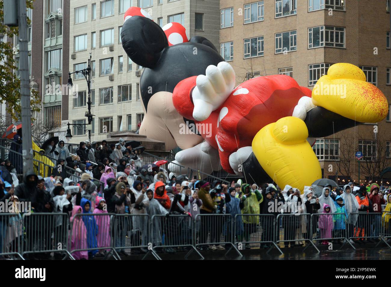 The Minnie Mouse balloon makes a turn onto Central Park South during ...