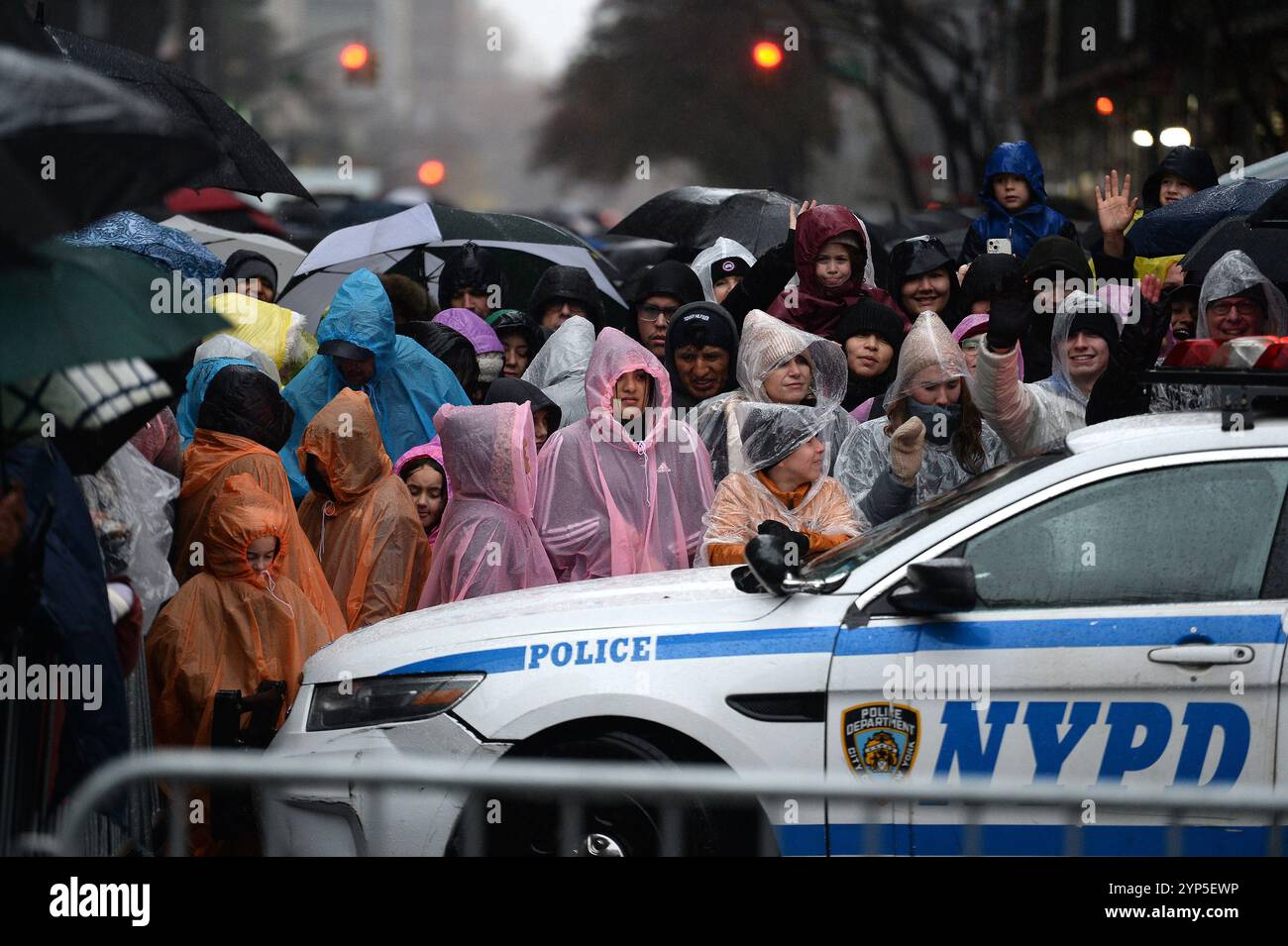 Onlookers in rain gear brave poor weather to attend Macy's 98th Annual ...