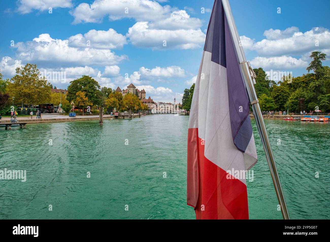 French flag flying off the back of a pleasure boat as it leaves Annecy ...
