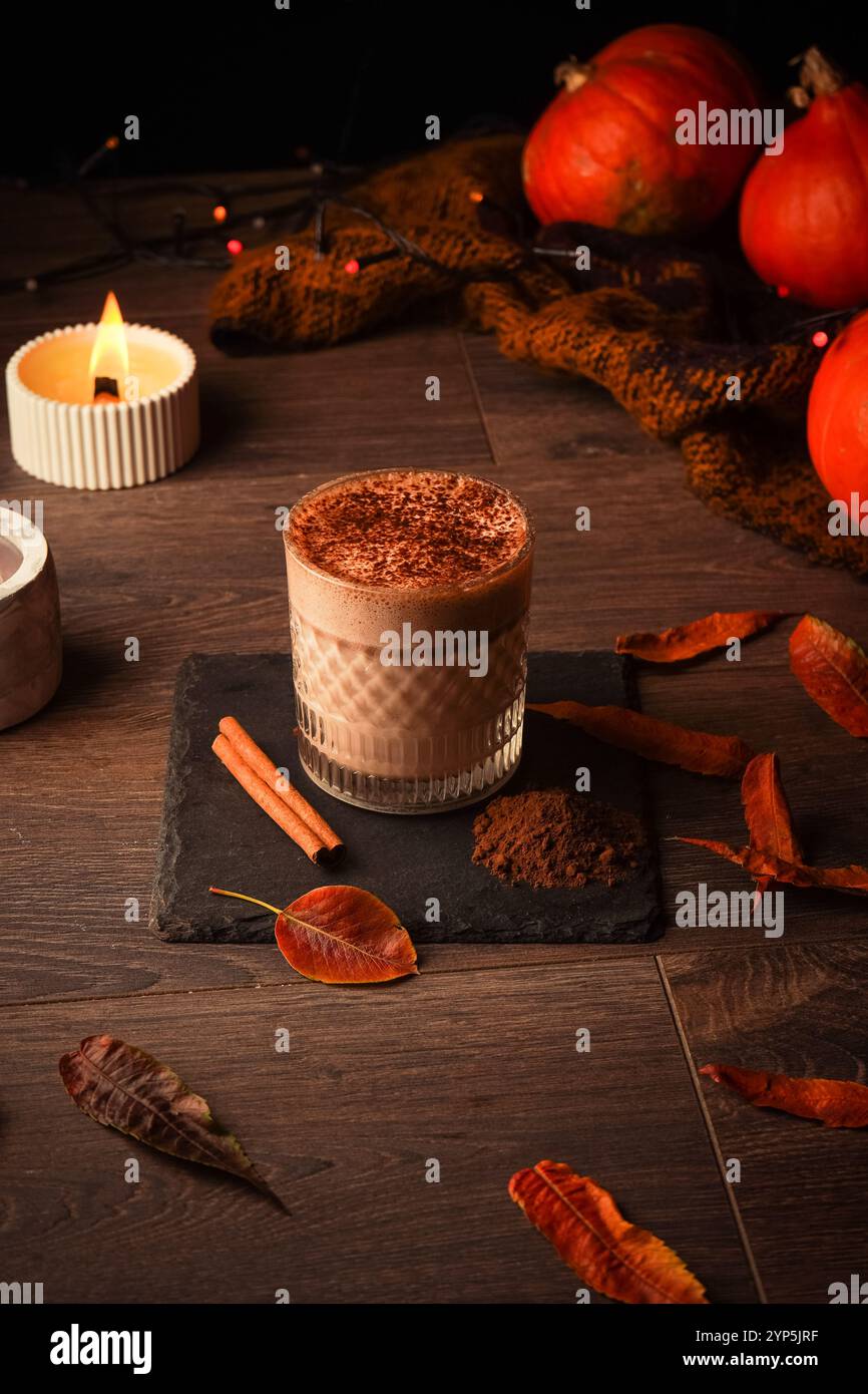 A cup of aromatic hot chocolate and cocoa powder isolated on autumn ...