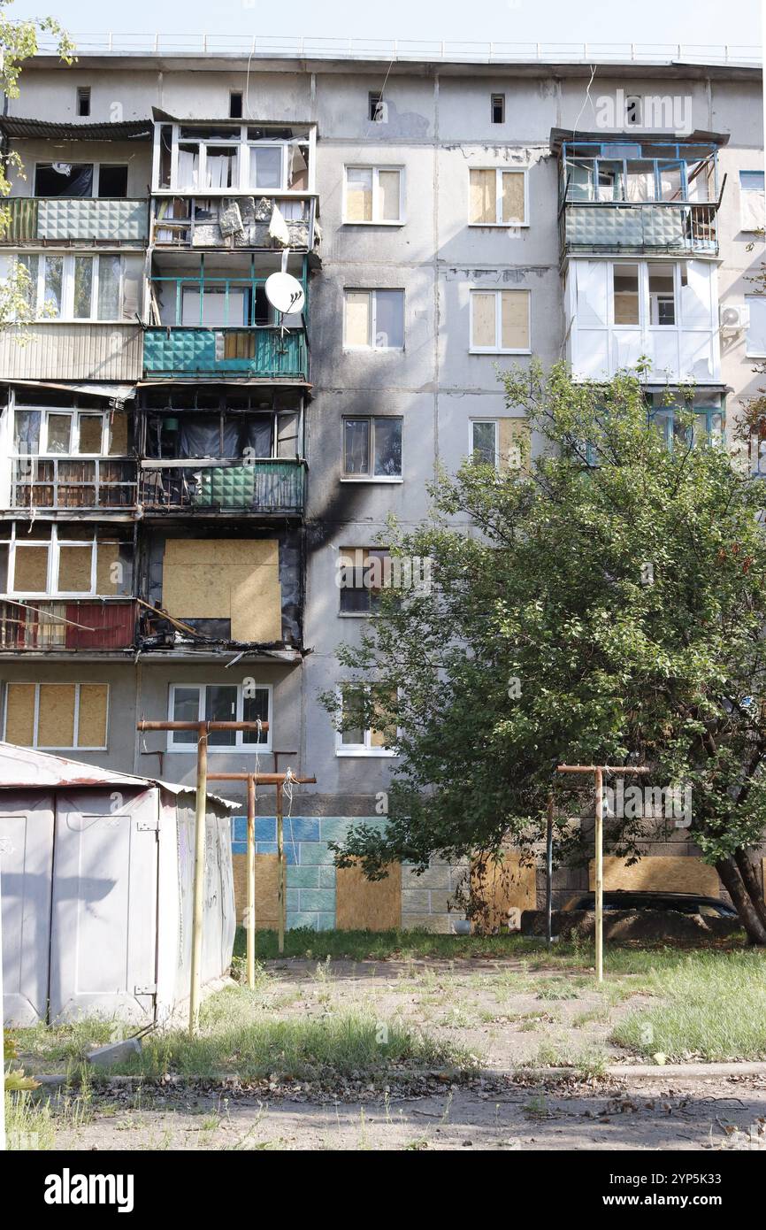 An apartment building with the aftermath of a fire after a rocket ...