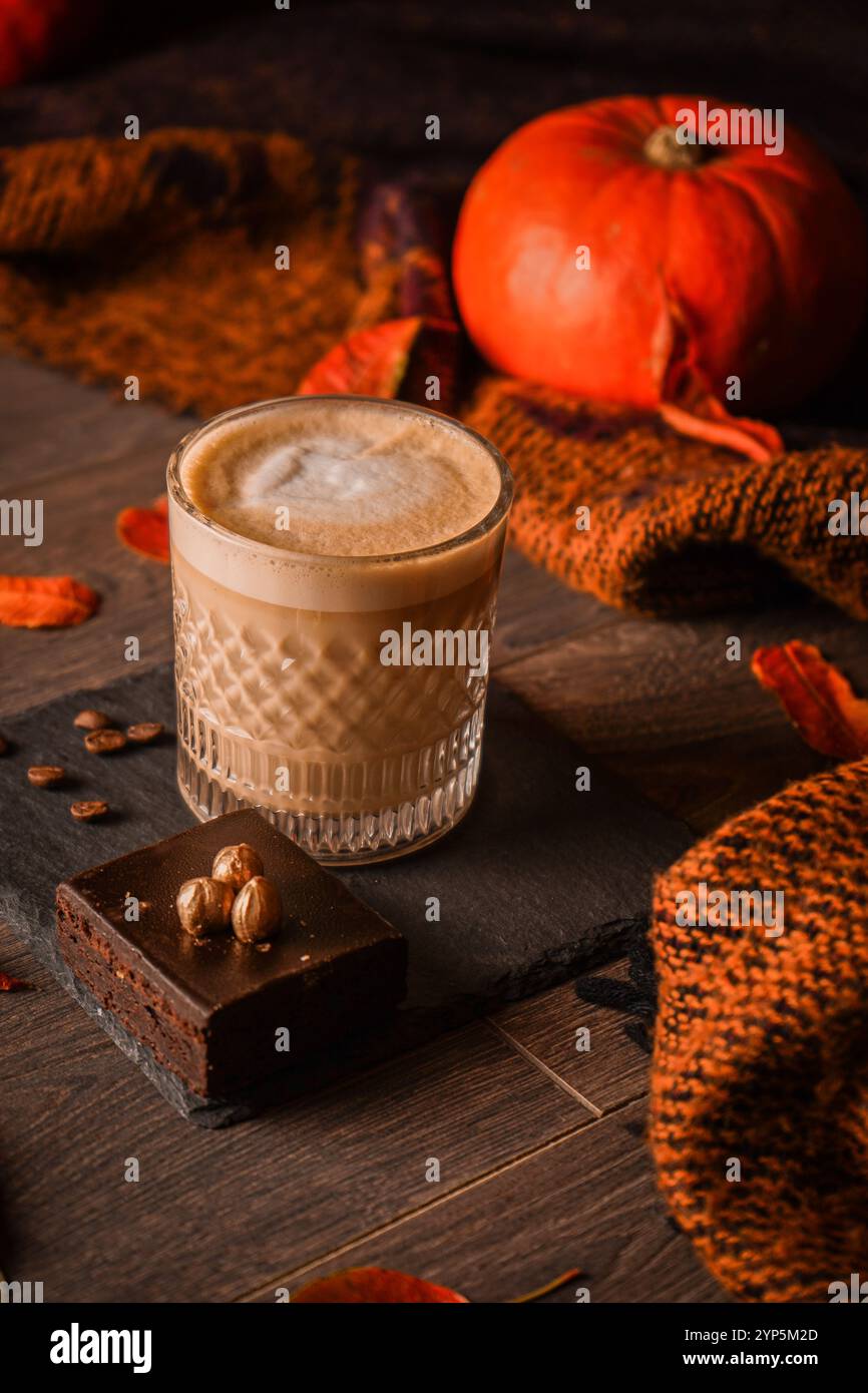 A signature latte featuring creamy milk and espresso, topped with a ...