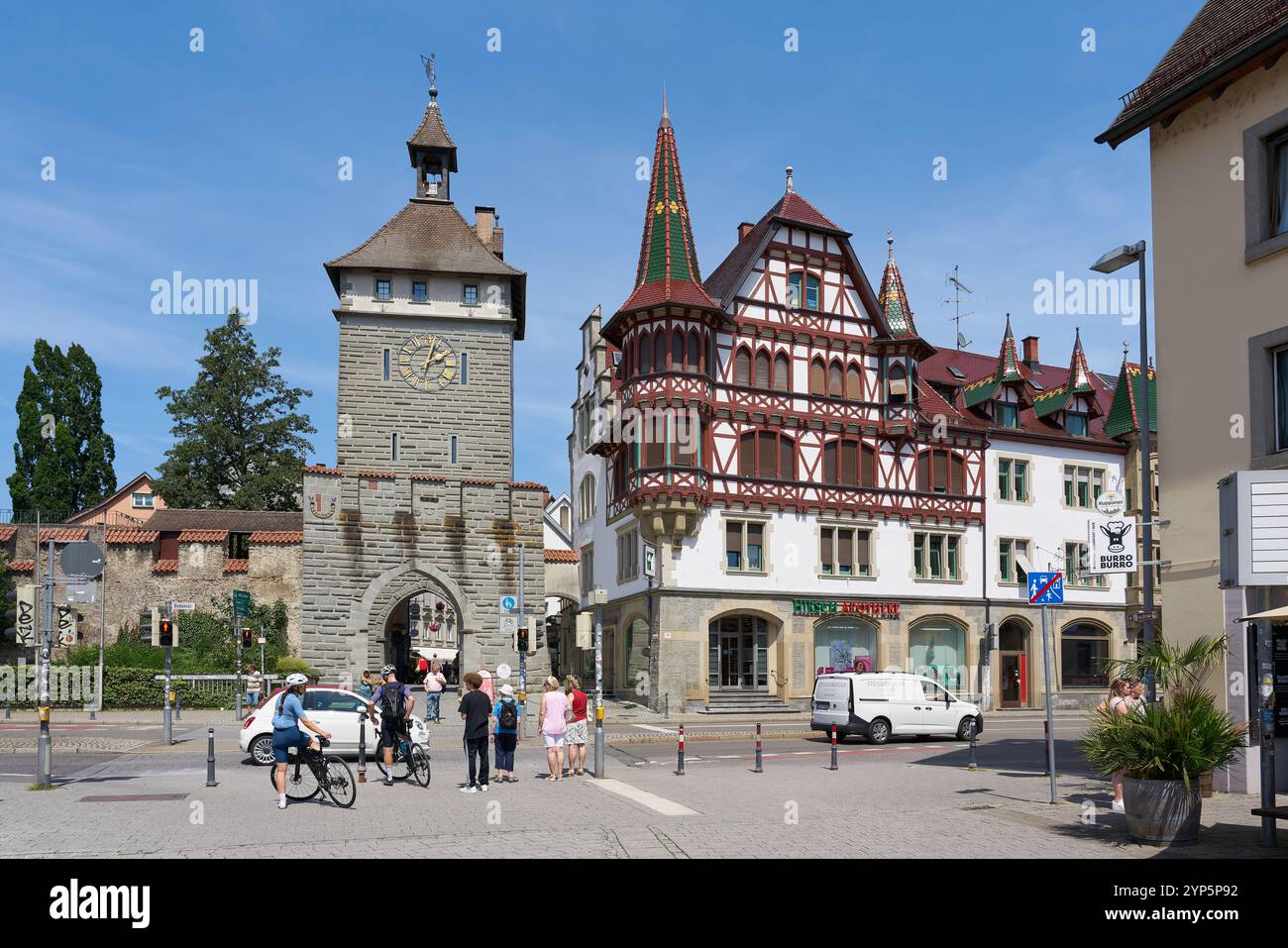 Road traffic at the Schnetztor, a historic city gate of the city of ...